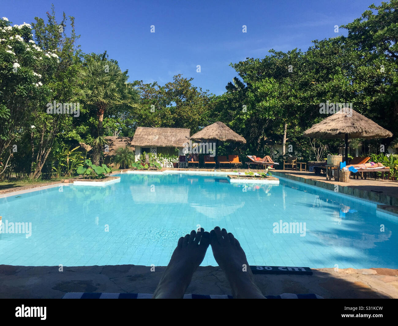 Paradise pool.. Hotel swimming pool in Cambodia Stock Photo - Alamy