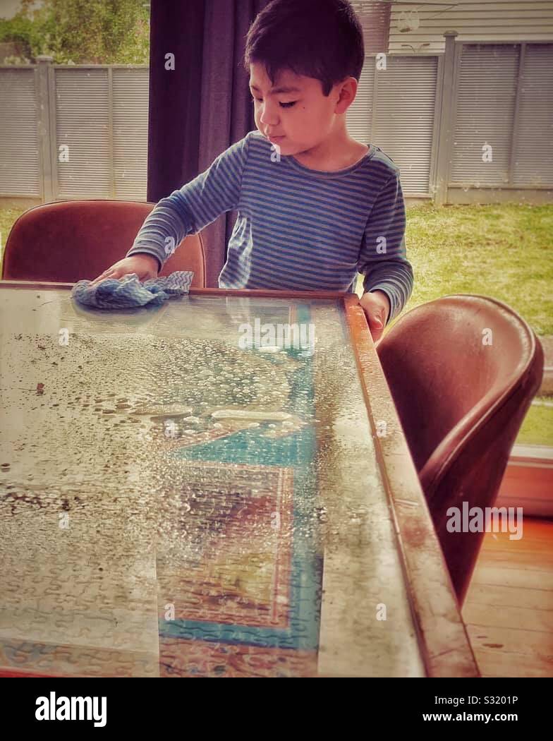 Retro boy cleaning chores hi-res stock photography and images - Alamy