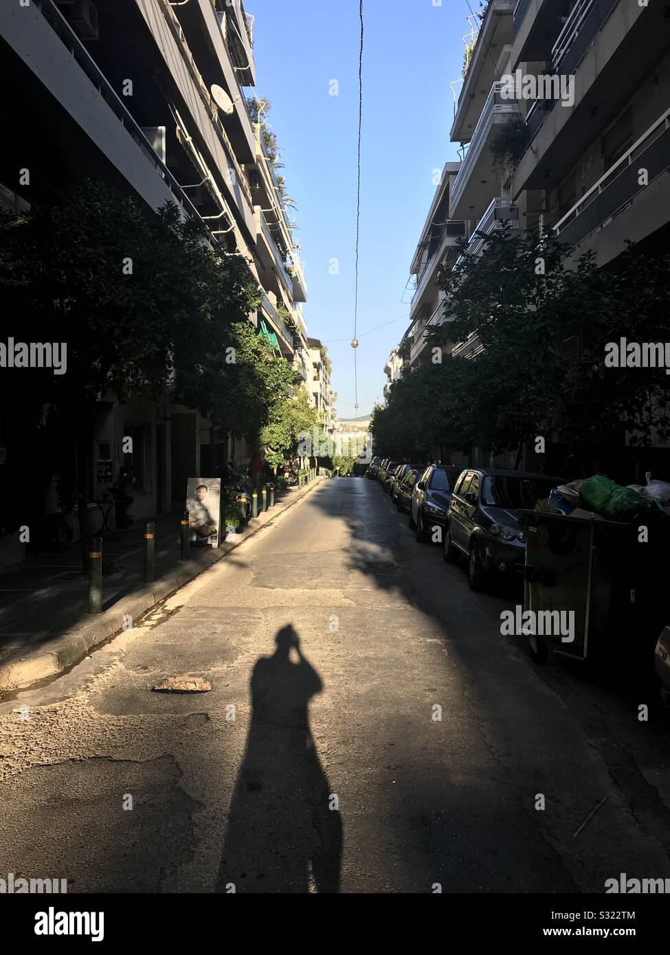 Street view with shadows. Athens streets Greece Stock Photo - Alamy
