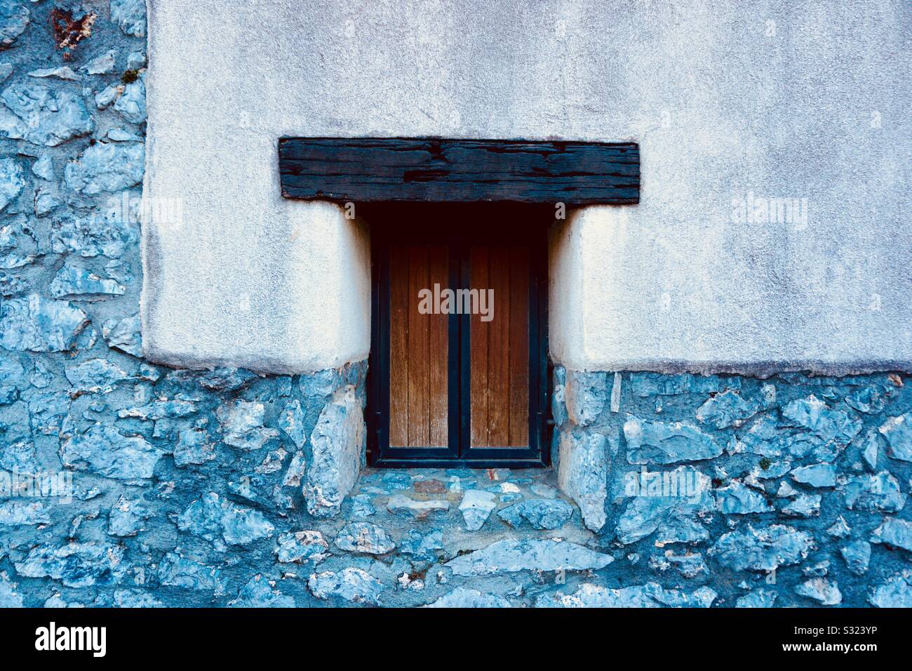 window on the wall of the house Stock Photo - Alamy