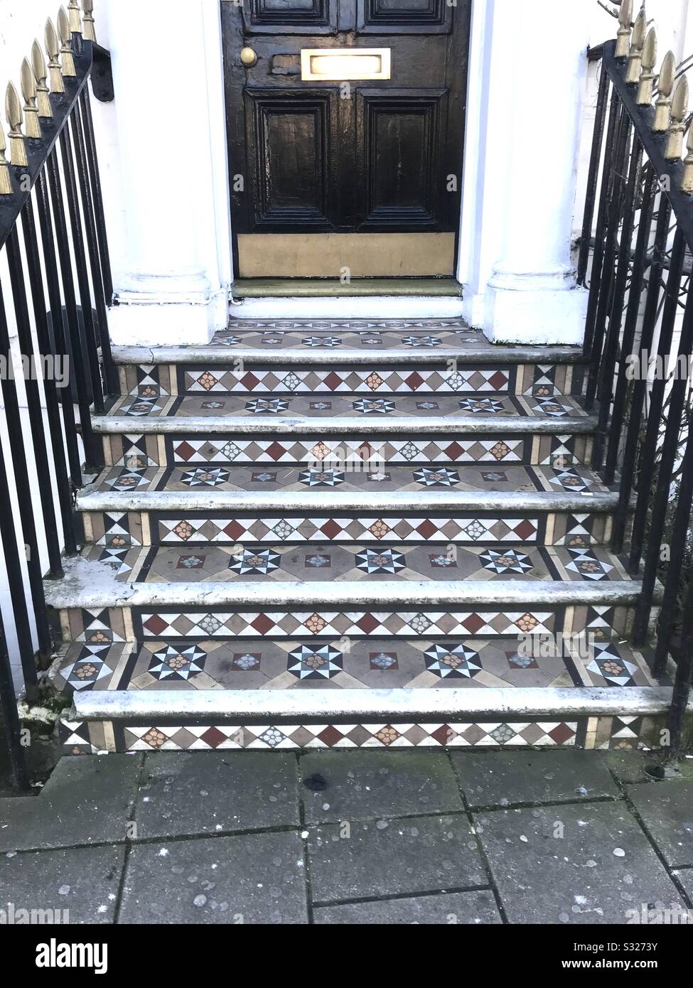 Tiled steps up to a Victorian house in Pavilion Gardens, Brighton Stock ...