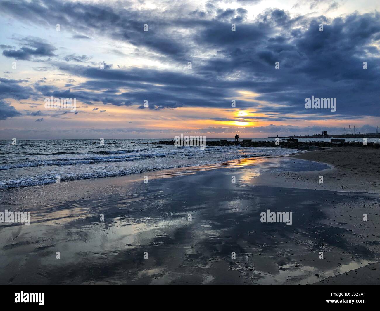 Sunset at the Beach in Italy Stock Photo - Alamy