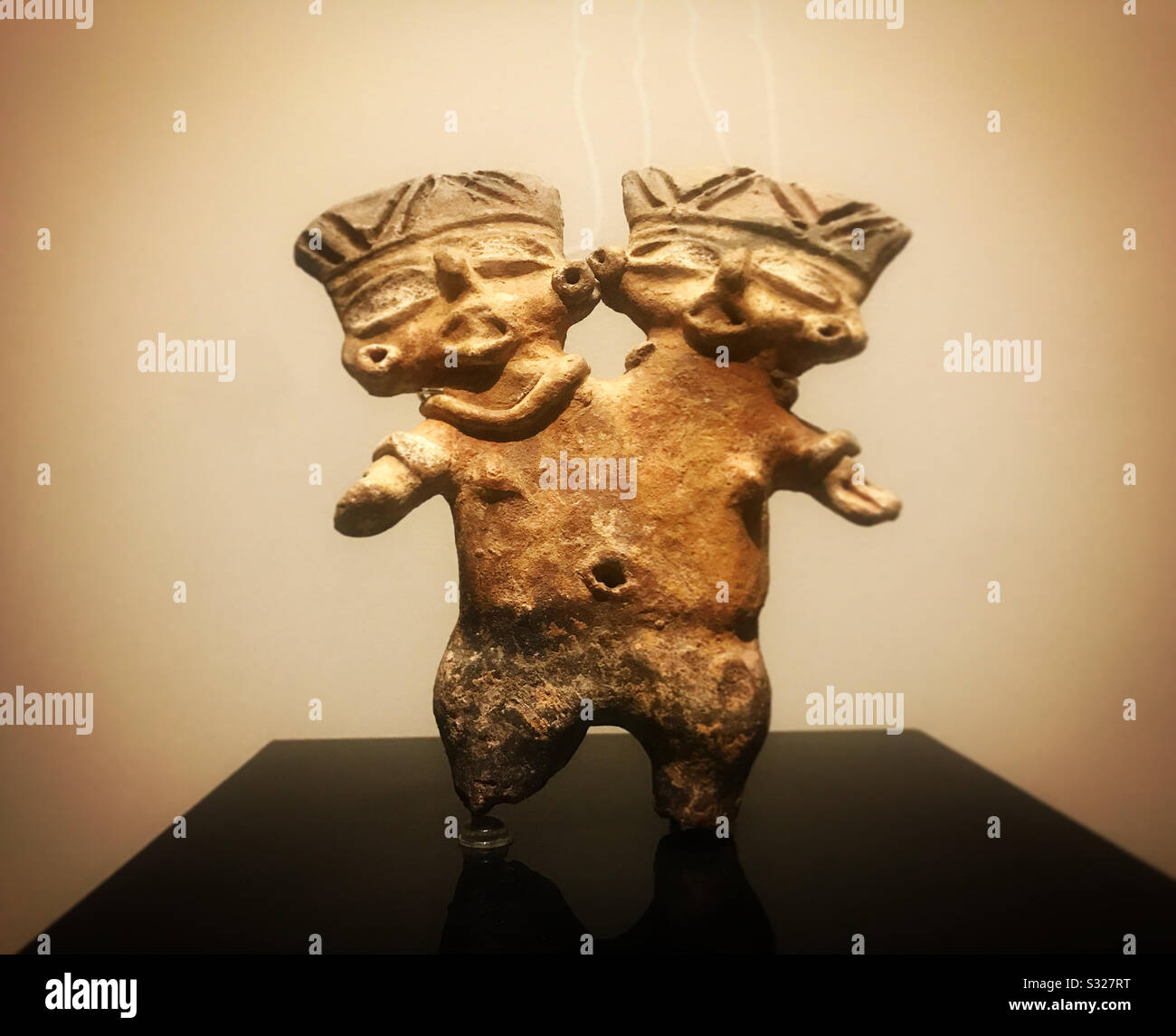 A sculpture of a man with two heads is displayed in the Templo Mayor ...
