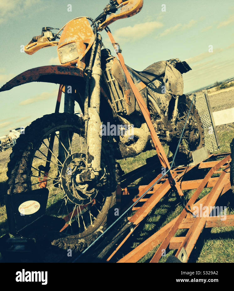 Dirty off road motorbike on trailer Stock Photo - Alamy