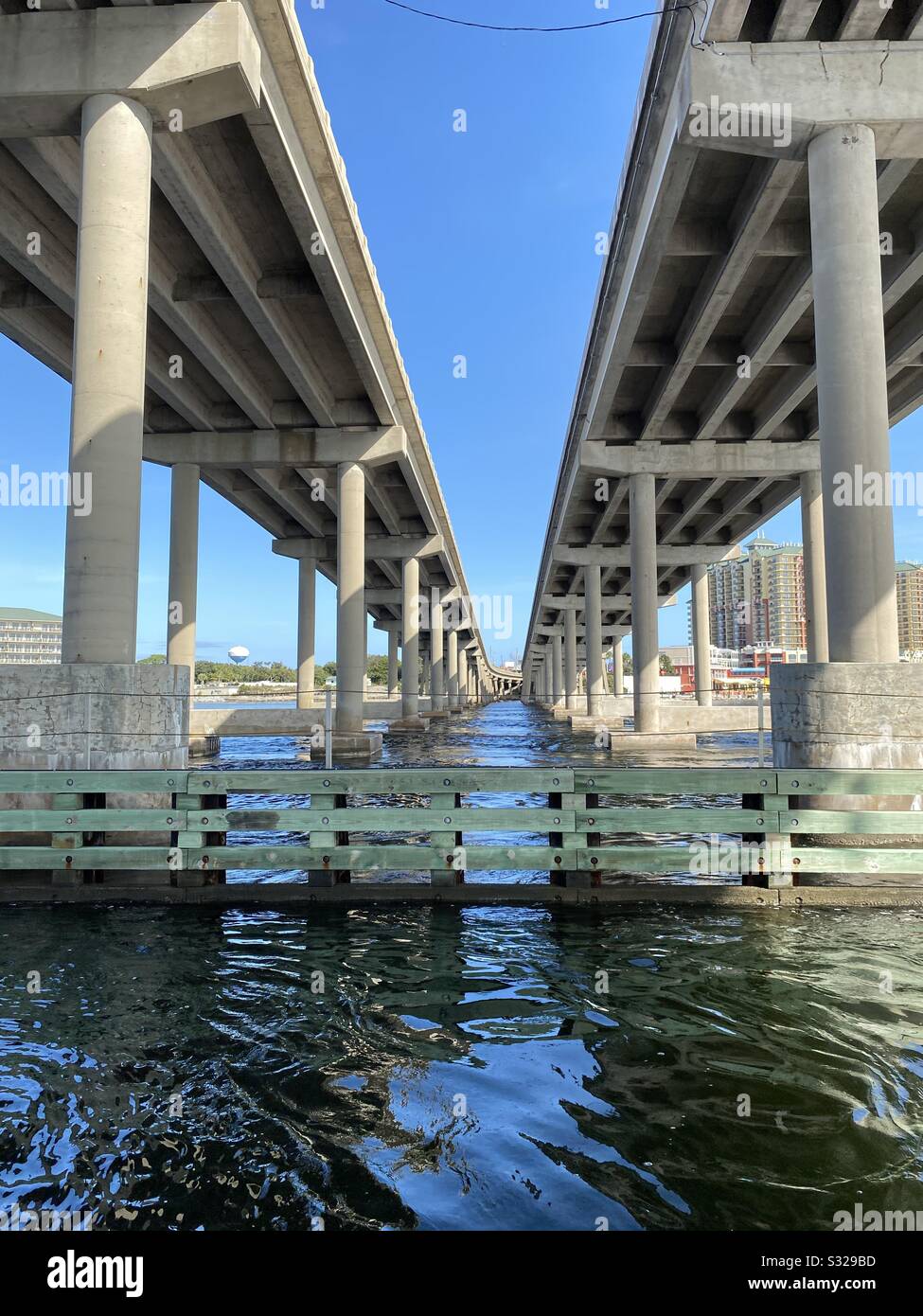 View from a boat on the water of the long Destin bridge in Florida ...