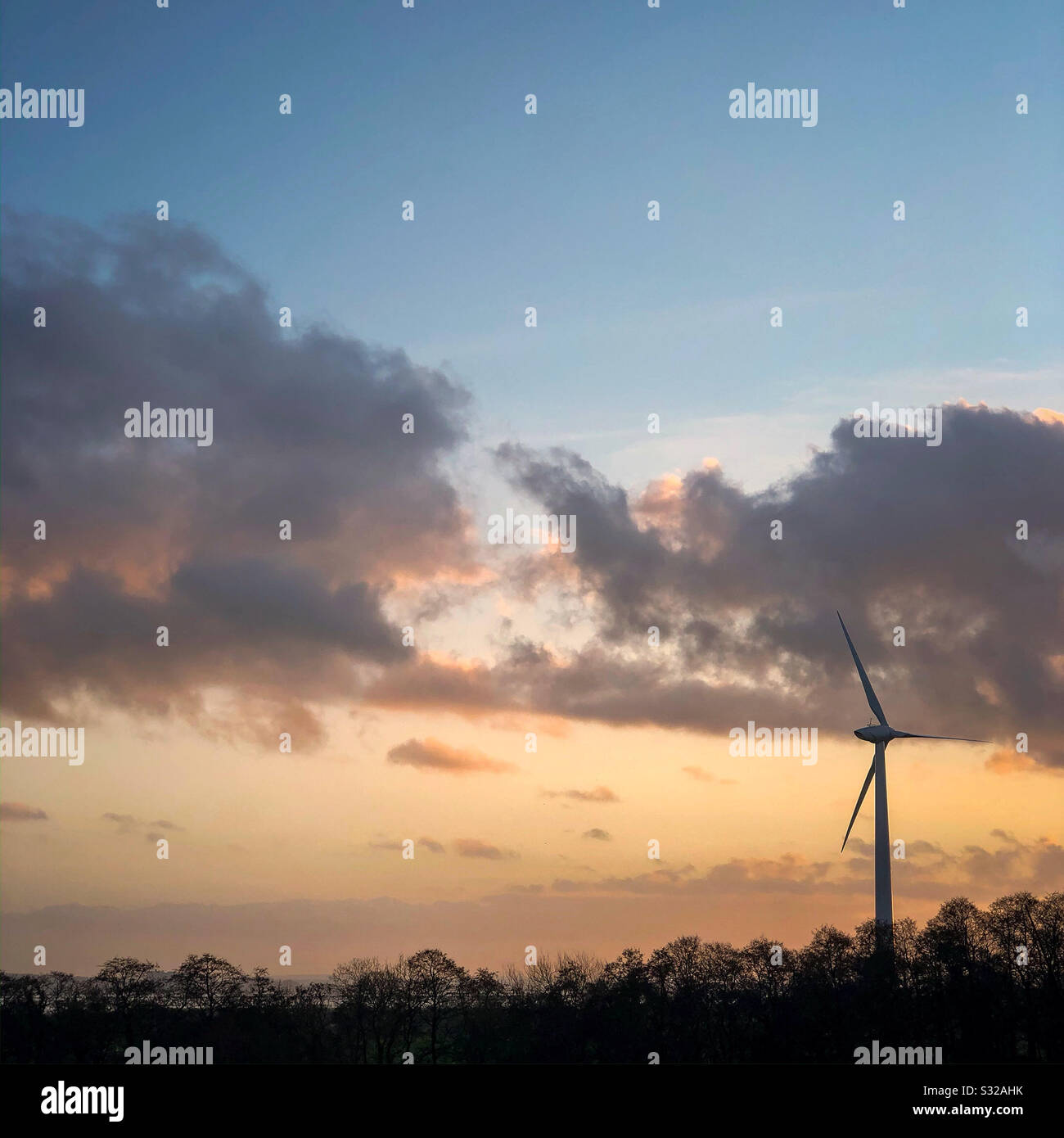 Wind turbine at sunset Stock Photo - Alamy