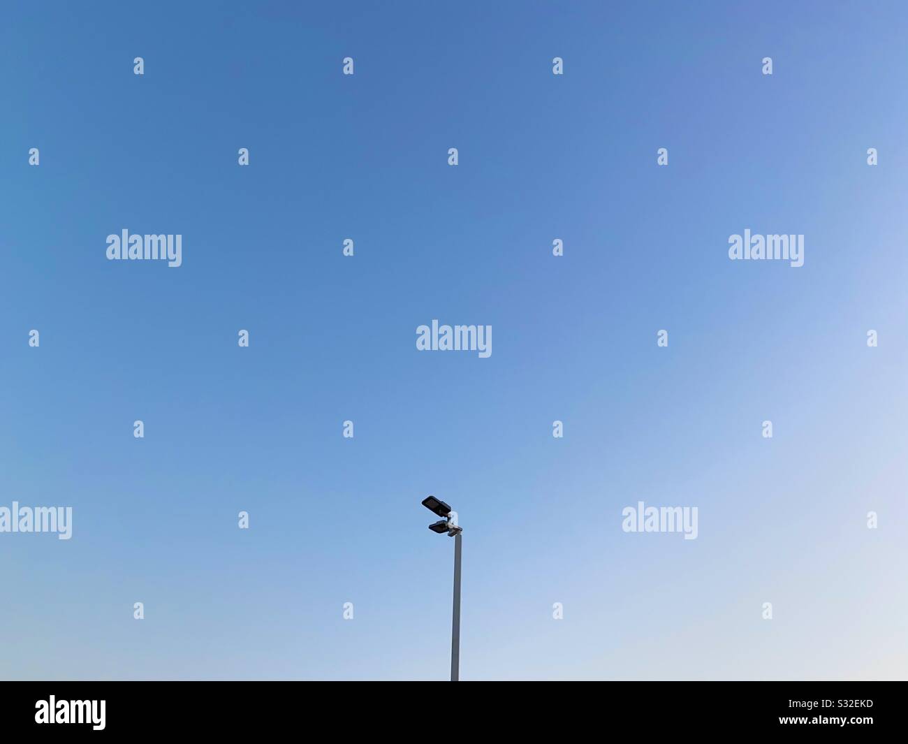 Street light with sky blue background Stock Photo - Alamy