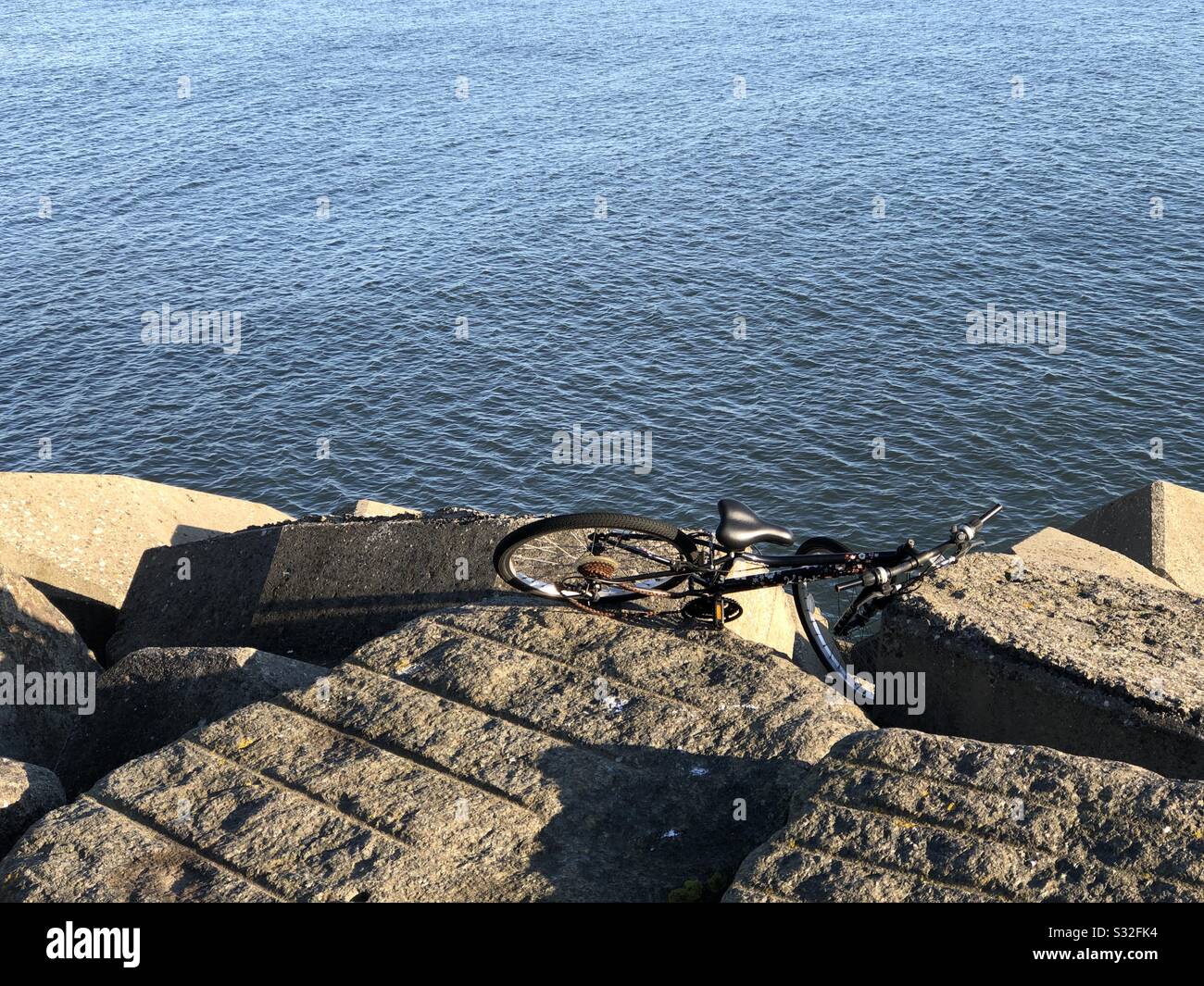 Abandoned bike on the rocks Stock Photo - Alamy