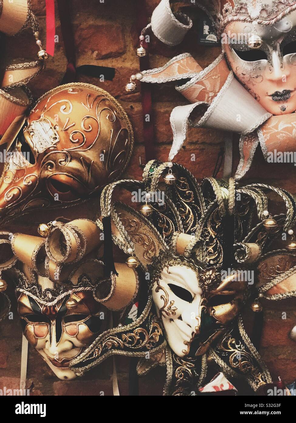 Masks on a brick wall hi-res stock photography and images - Alamy