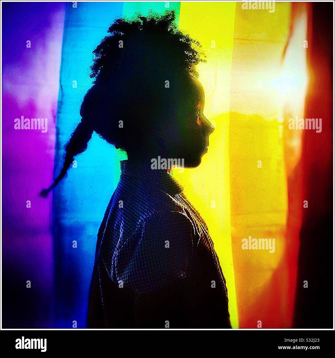 A child in front of a Pride flag Stock Photo - Alamy