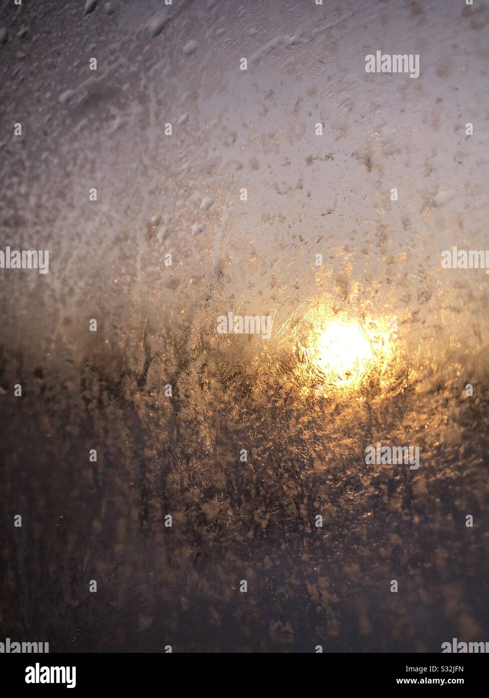 the beautiful sunset through a frosted bus window Stock Photo - Alamy