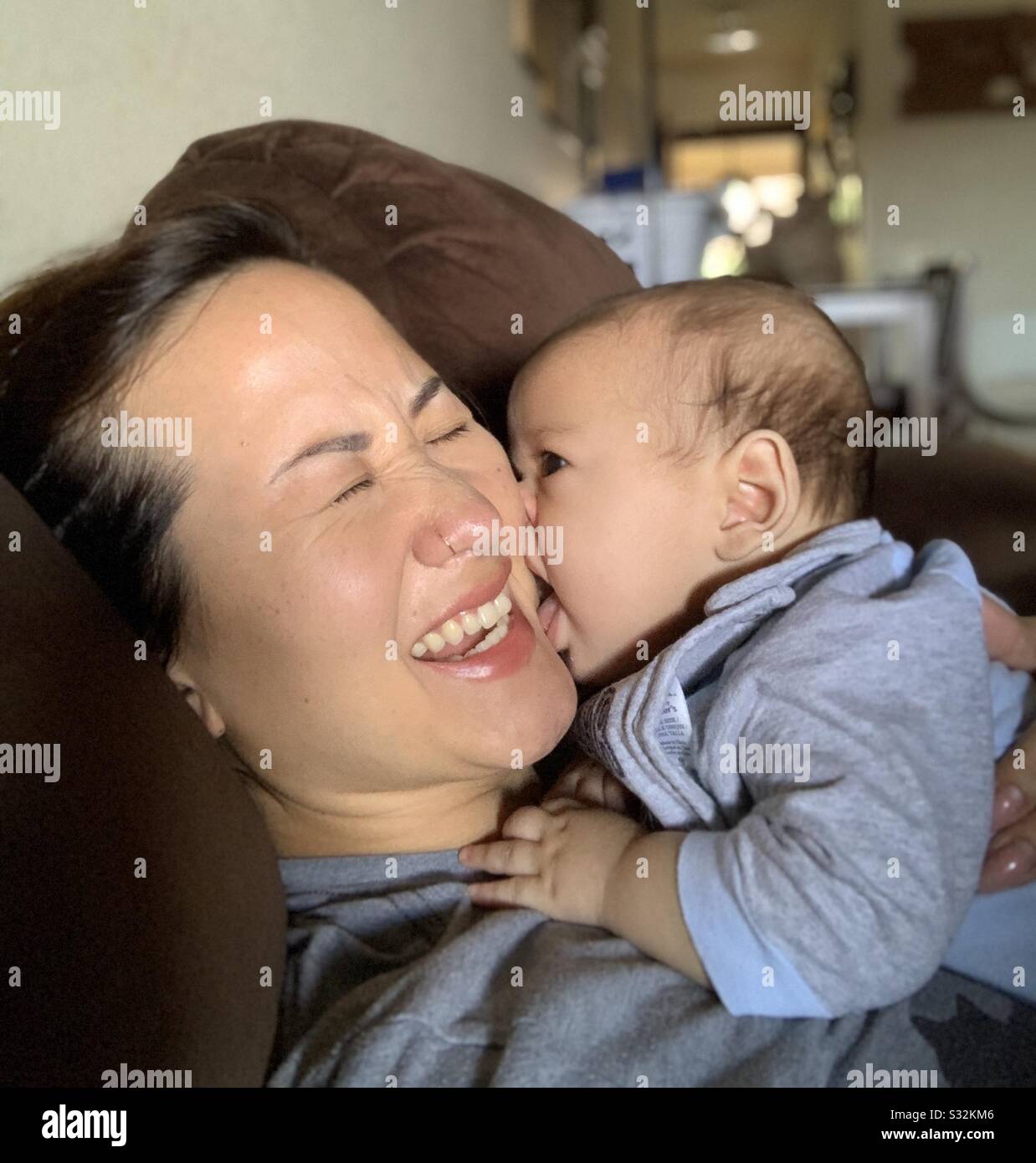 Laughing mother hi-res stock photography and images - Alamy