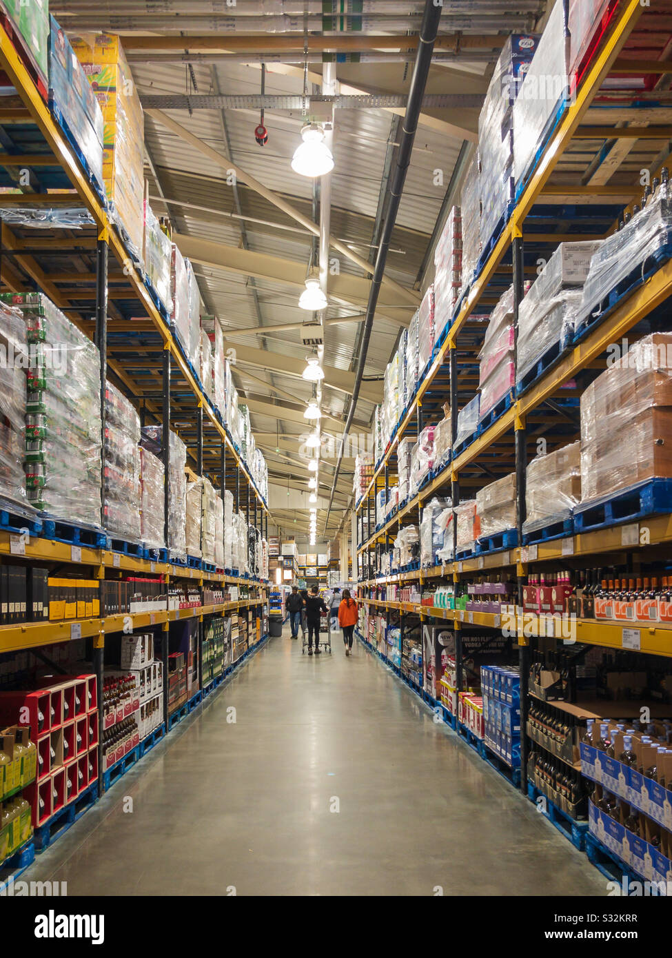 Tall shelves full of goods in a wholesale warehouse Stock Photo - Alamy