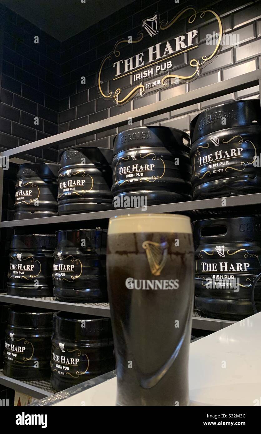 Guinness on the bar Stock Photo - Alamy