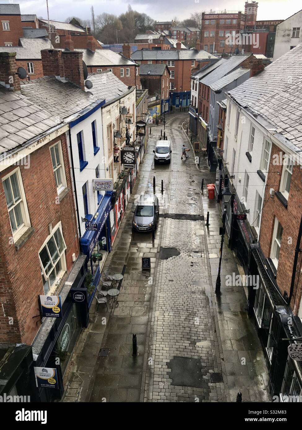 An Urban Street In Stockport Greater Manchester With Terraced Houses