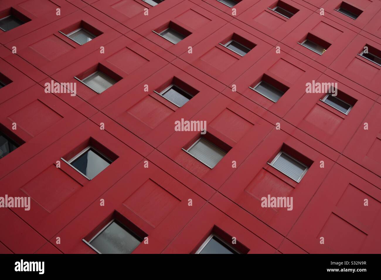 window on the red facade Stock Photo - Alamy