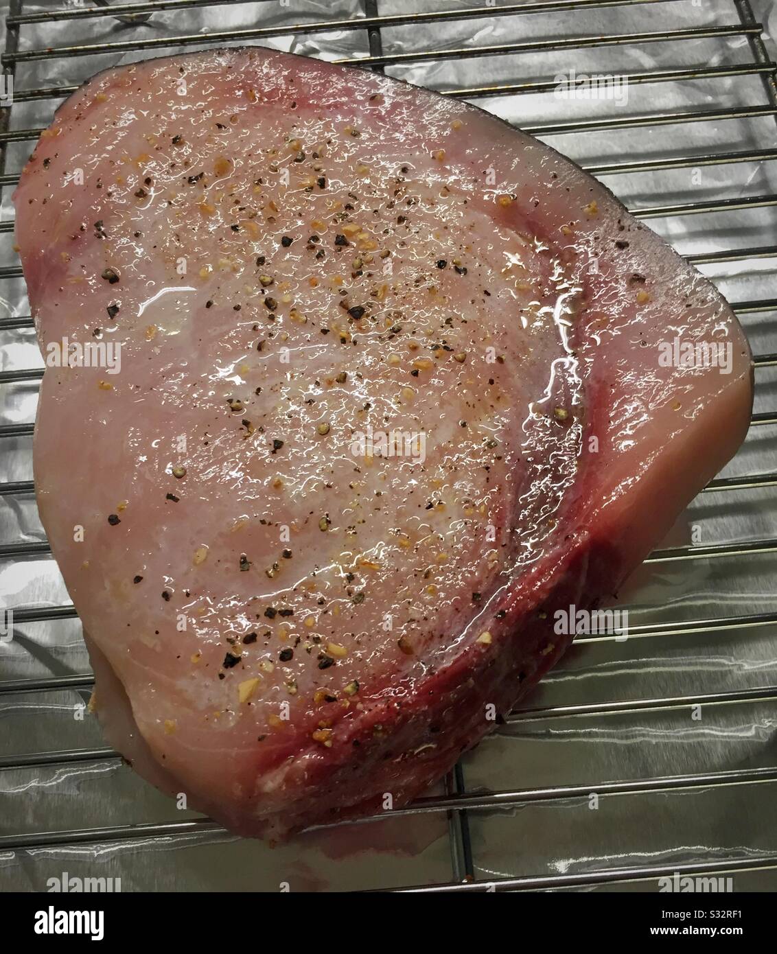 Fresh raw swordfish steak seasoned and ready to grill, USA Stock Photo ...