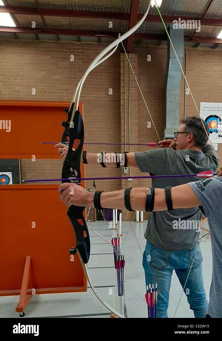 Archery target practice, bow and arrow Stock Photo - Alamy