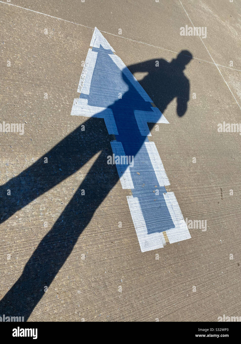 Power shadow, distorted abstract perspective of man and arrow shadow ...