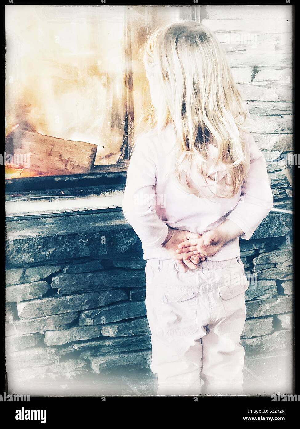 Girl by fireplace hi-res stock photography and images - Alamy