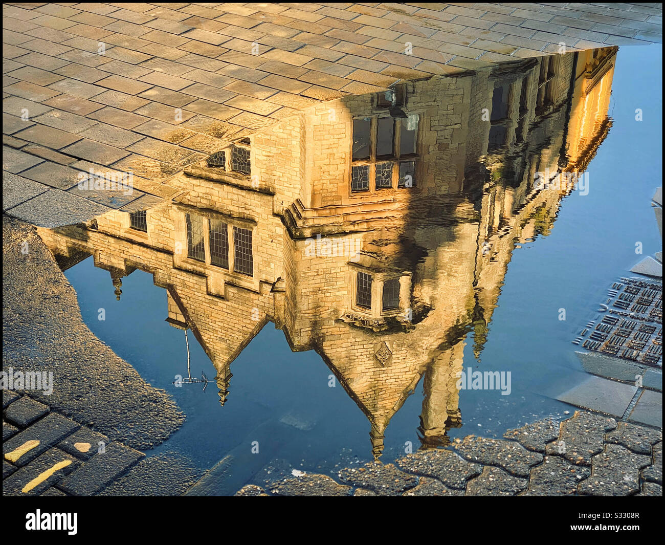 Everything is a bit confusing. A large building is upside down and ...