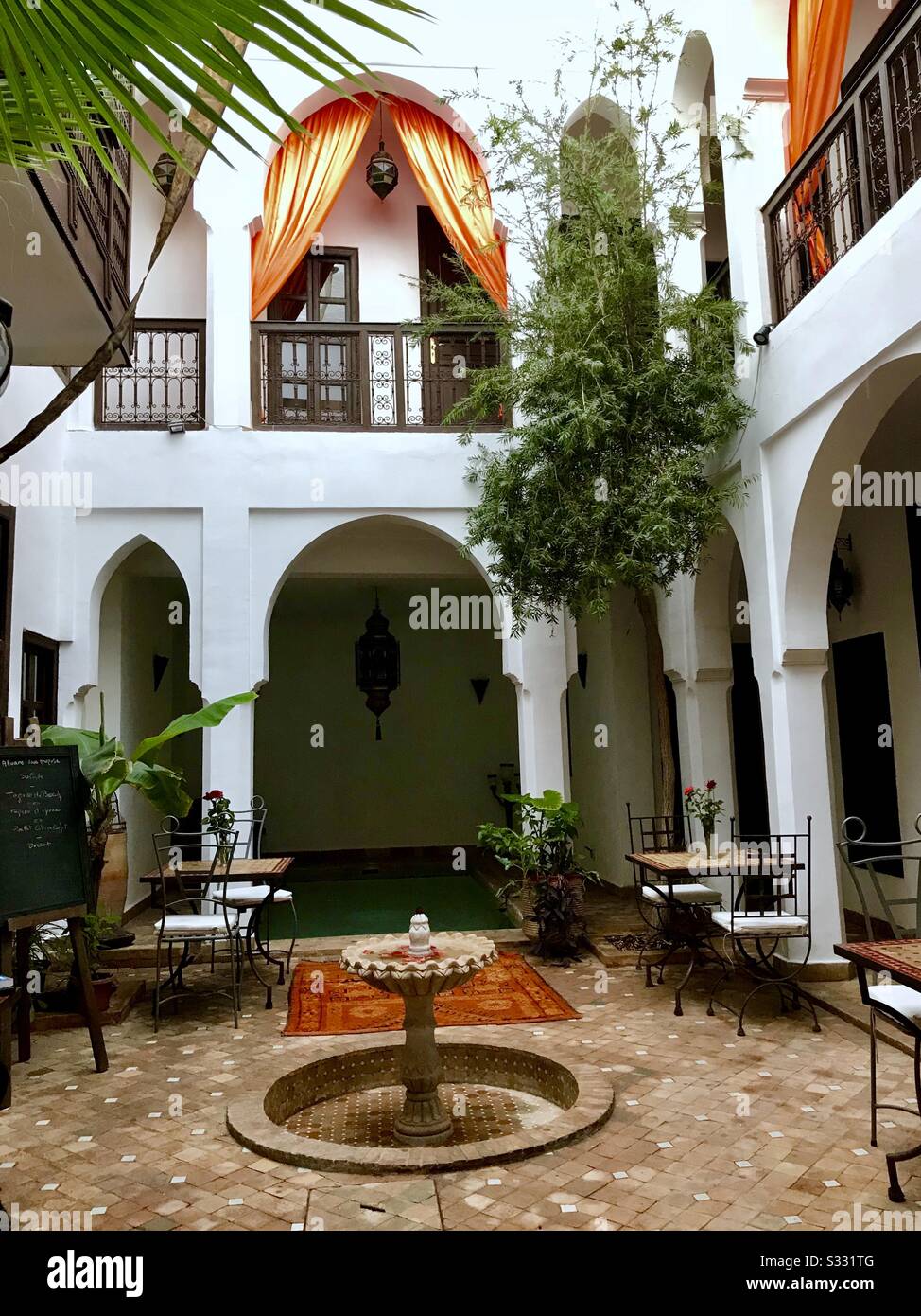 Relaxing in a riyadh in Marrakech Stock Photo - Alamy