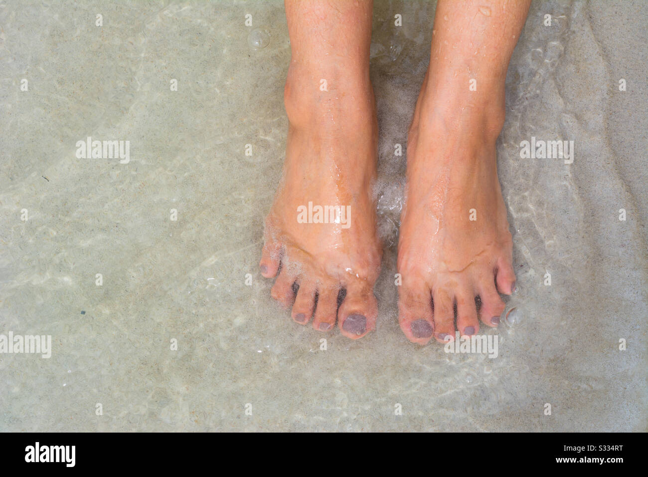 Foot on sand hi-res stock photography and images - Alamy