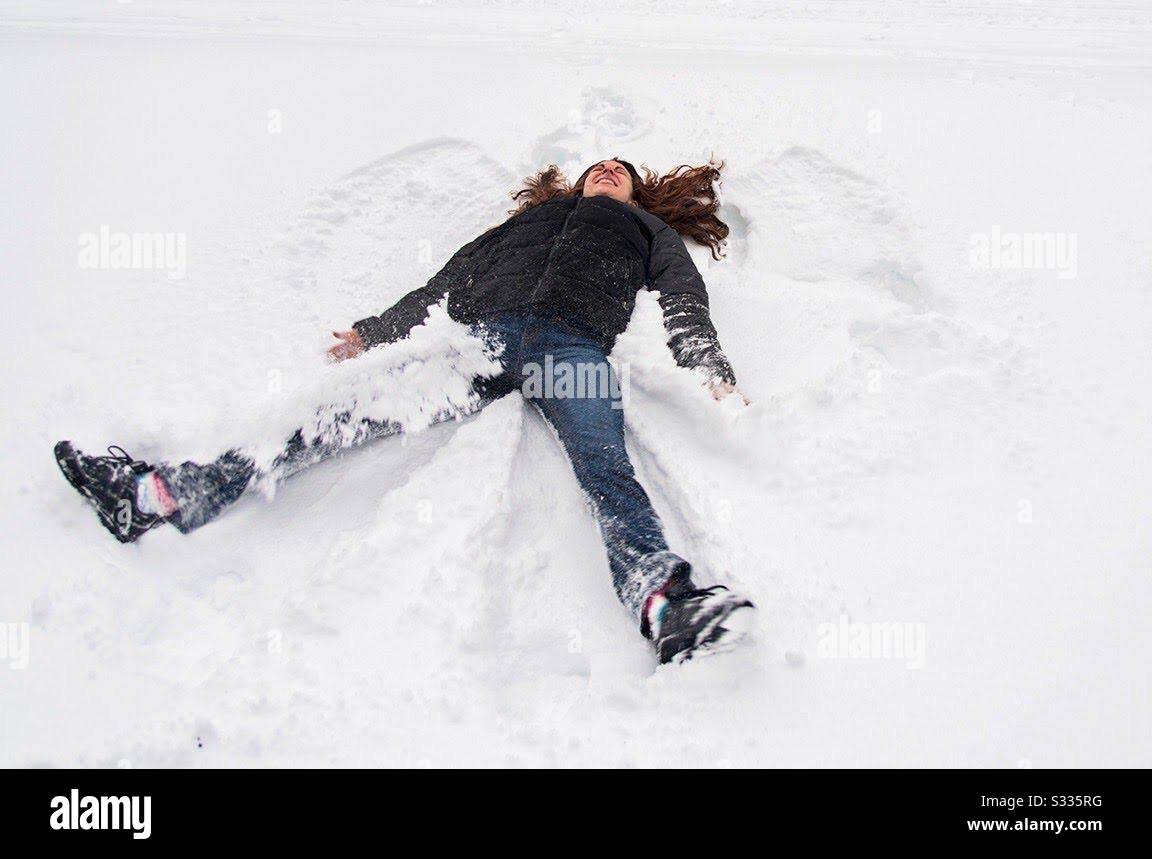 Woman snow angel hi-res stock photography and images - Alamy