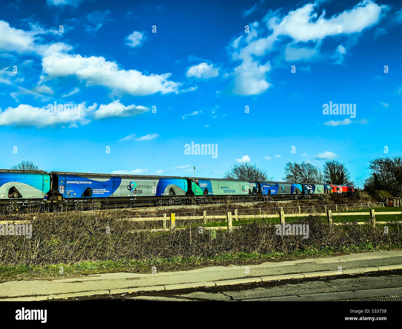 Drax northern powerhouse Train passing by village Stock Photo - Alamy