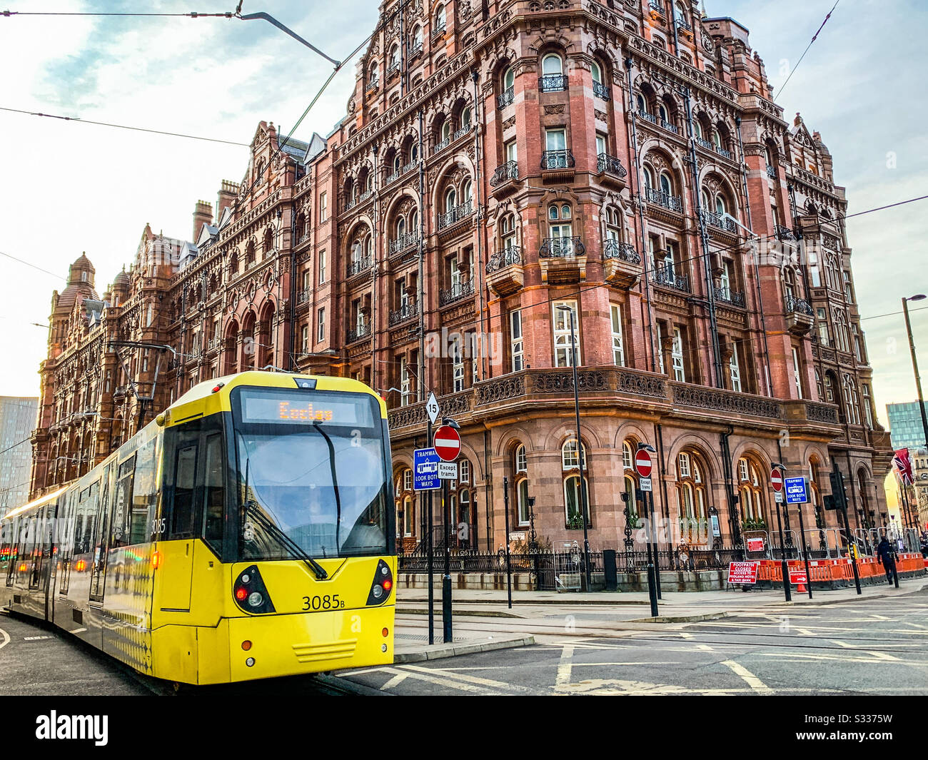 Metrolink tram passing the midland hotel in Manchester City centre ...