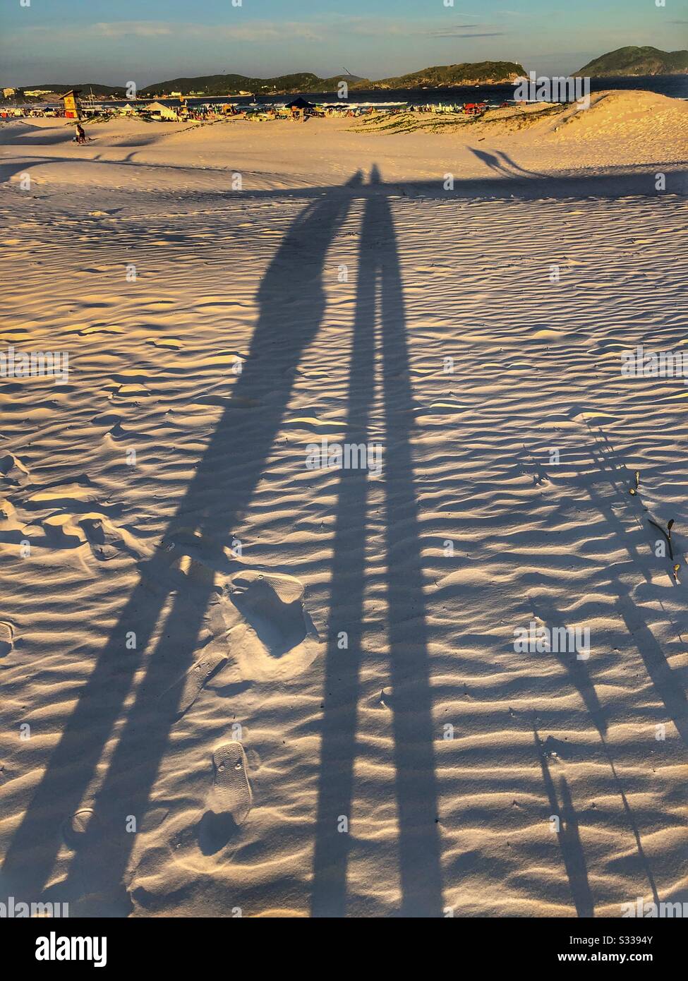 Two silhouettes in the sand Stock Photo - Alamy