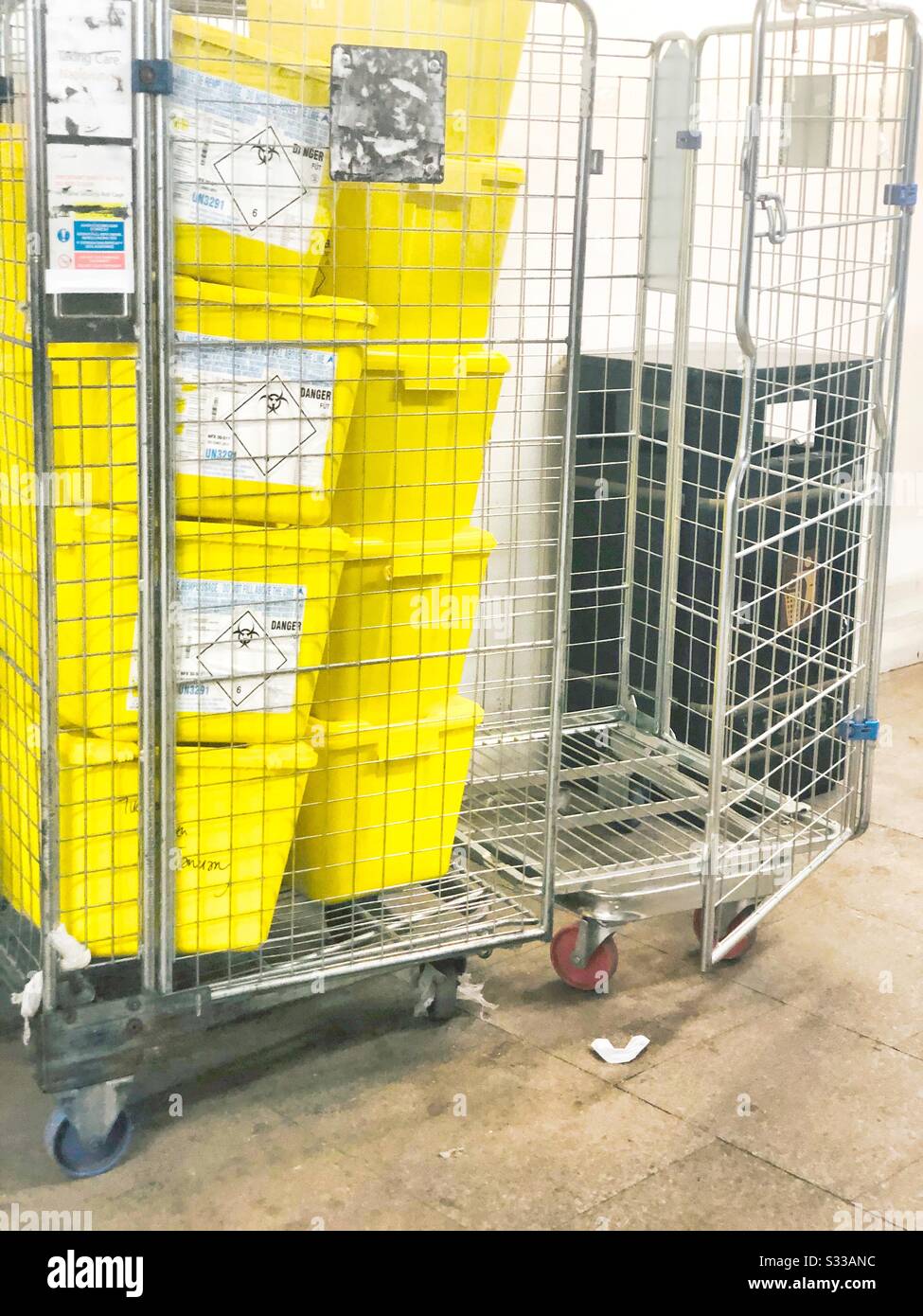 Medical waste containers near public bin Stock Photo - Alamy