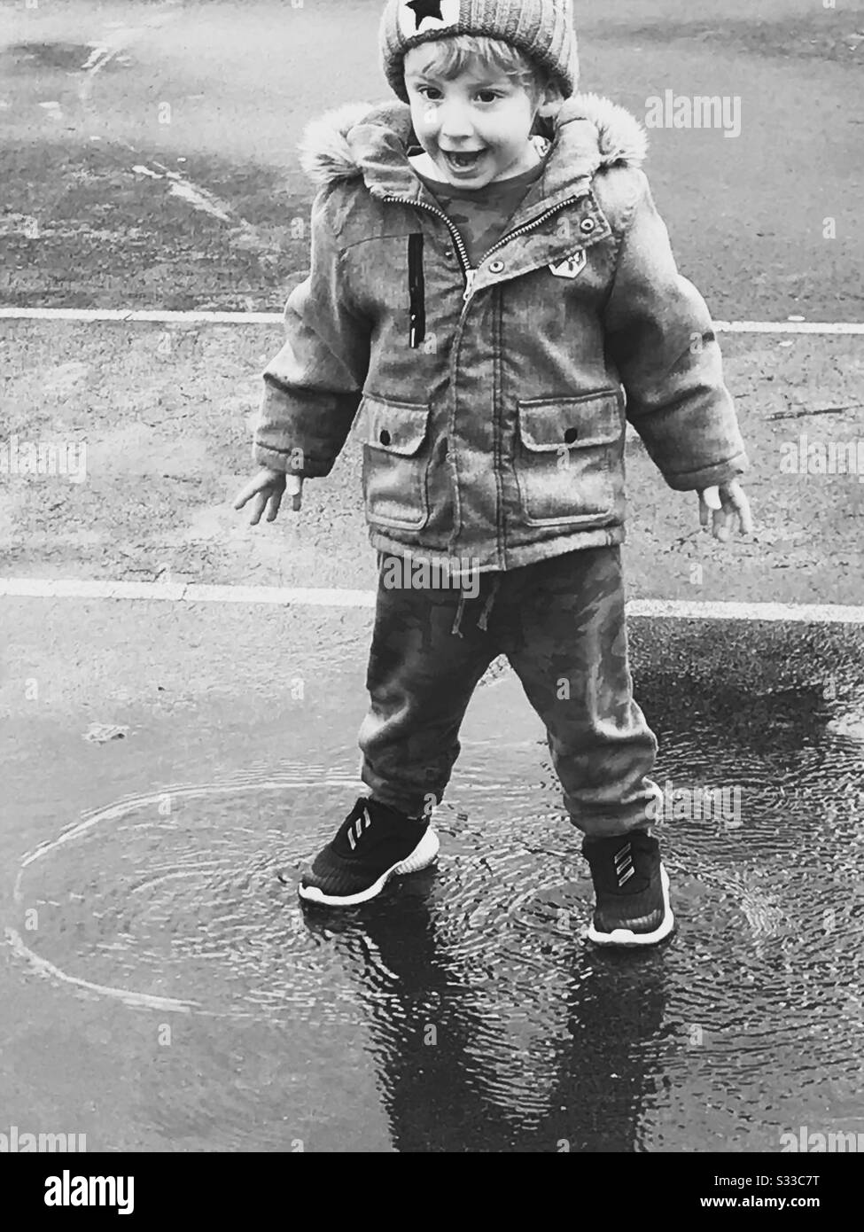 Muddy puddle Black and White Stock Photos & Images - Alamy