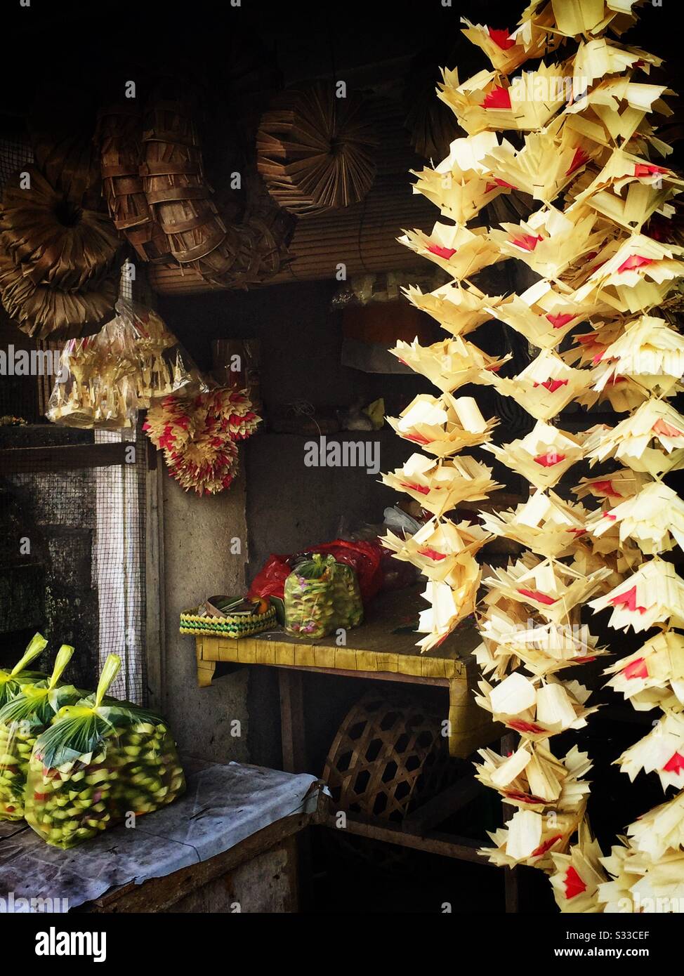 A stall sells items for daily offerings and other festivals in Ubud ...
