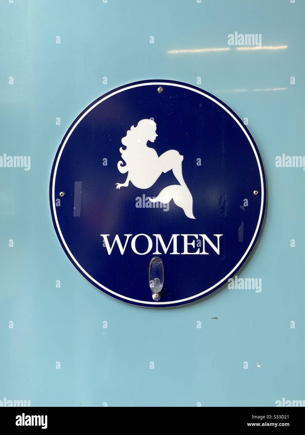 Mermaid women’s bathroom sign Stock Photo - Alamy