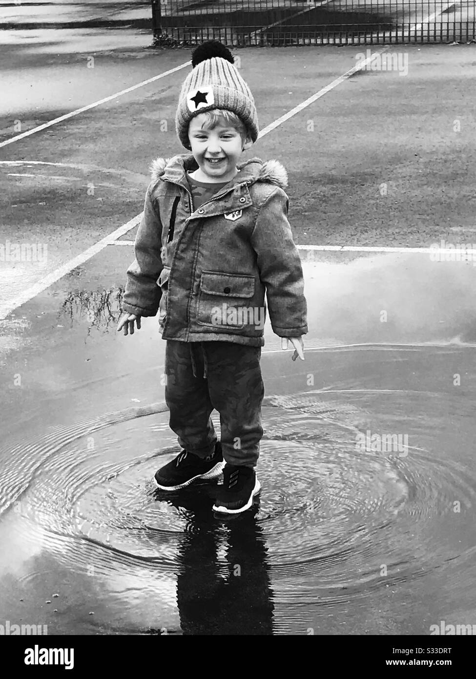 Splashing in puddles Stock Photo - Alamy