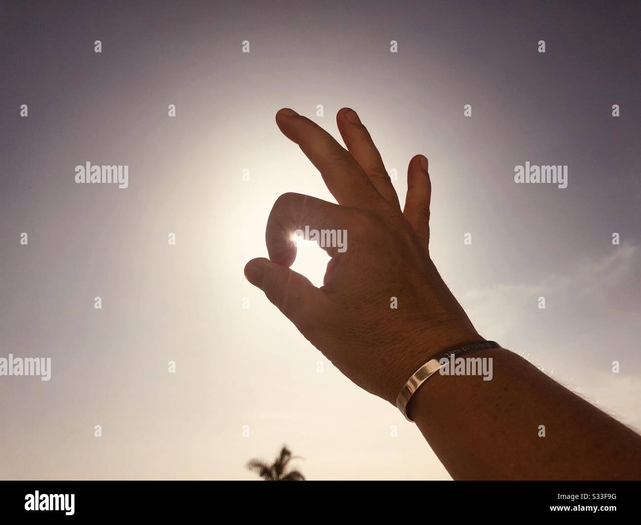 Woman making OK hand signal Stock Photo - Alamy