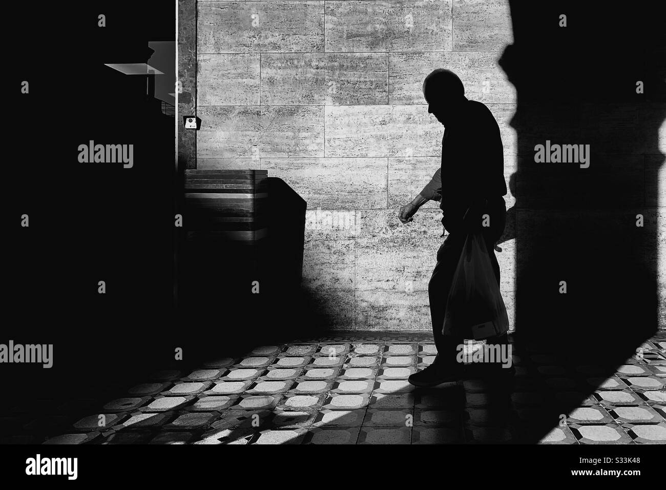 Stepping out of the shadows Black and White Stock Photos & Images - Alamy