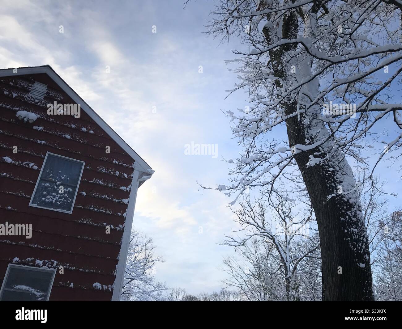 Red house in winter wonderland Stock Photo - Alamy