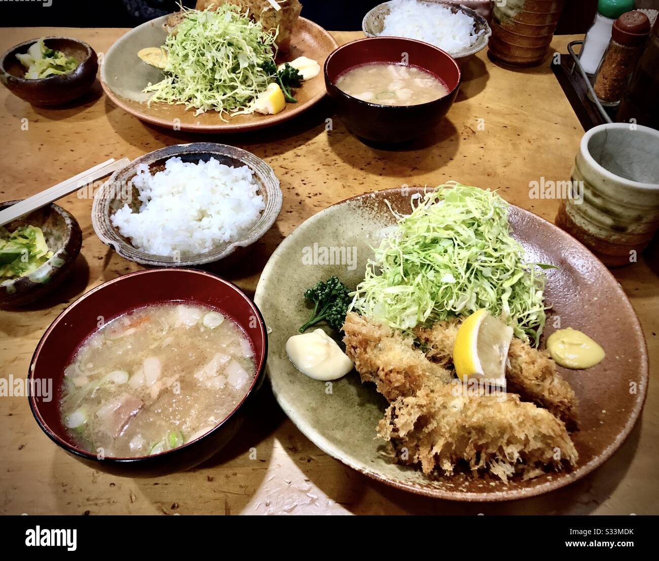 Kaki fry ( Japanese fried oysters) with cabbage, rice, pickles, and ...
