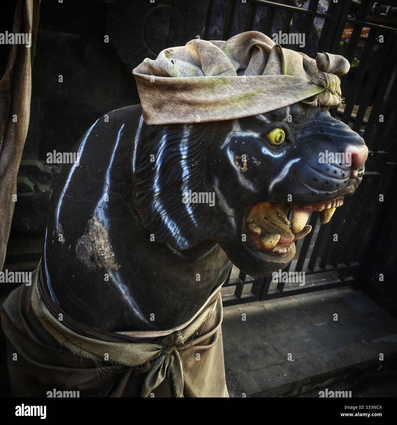 A decorated tiger guards the entrance to a house, Candidasa, Bali, Indonesia Stock Photo - Alamy