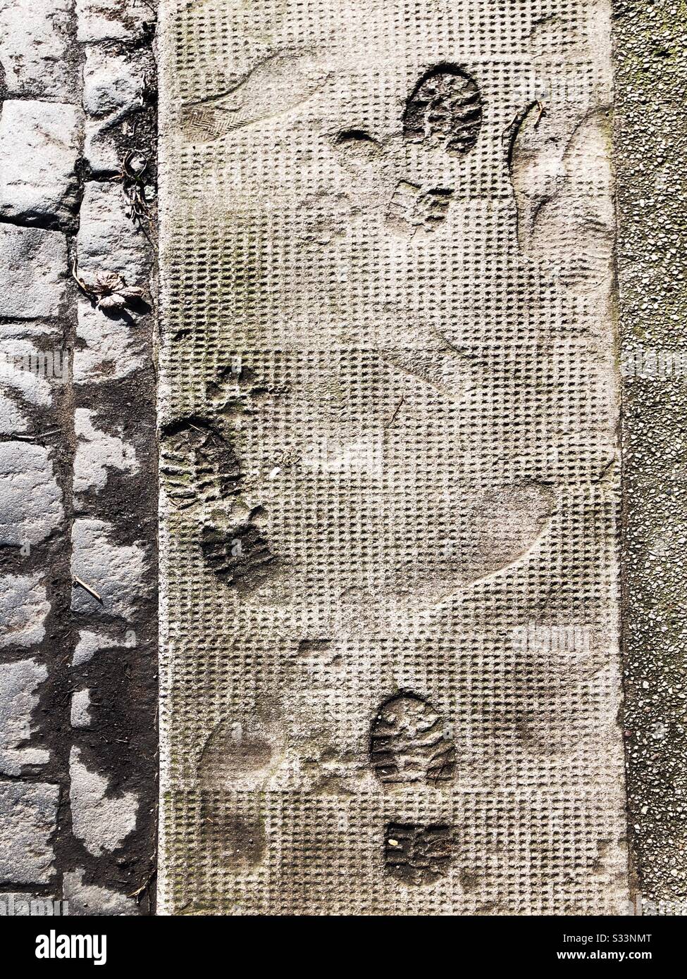Footprints in cement Stock Photo - Alamy
