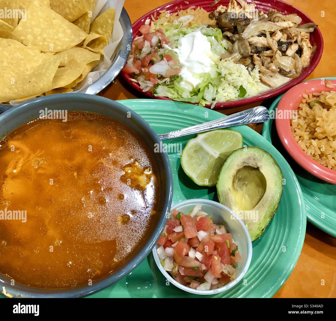 An overview of various dishes of Mexican food on colorful plates Stock ...