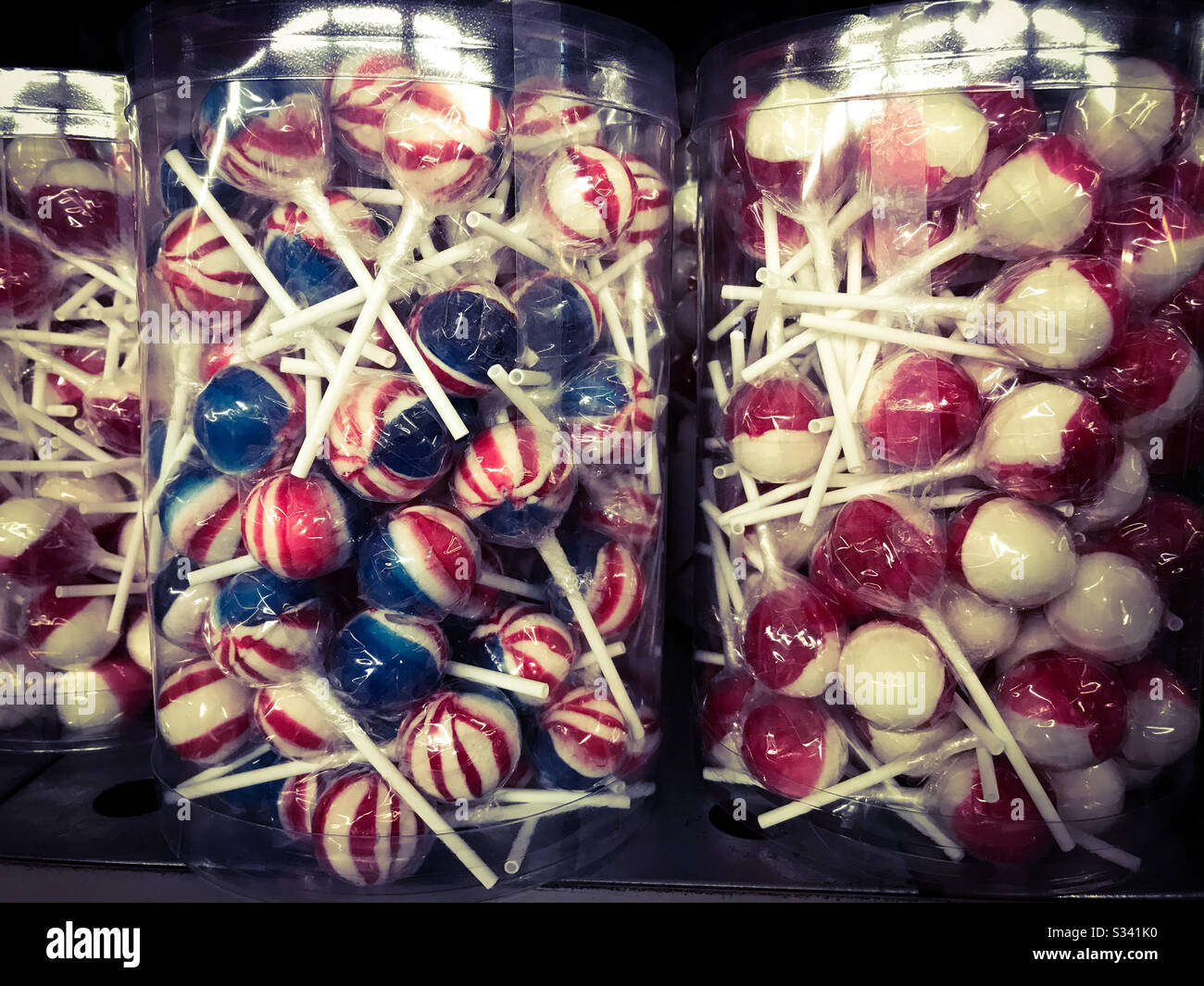Round colorful candy lollipops in a shop Stock Photo - Alamy