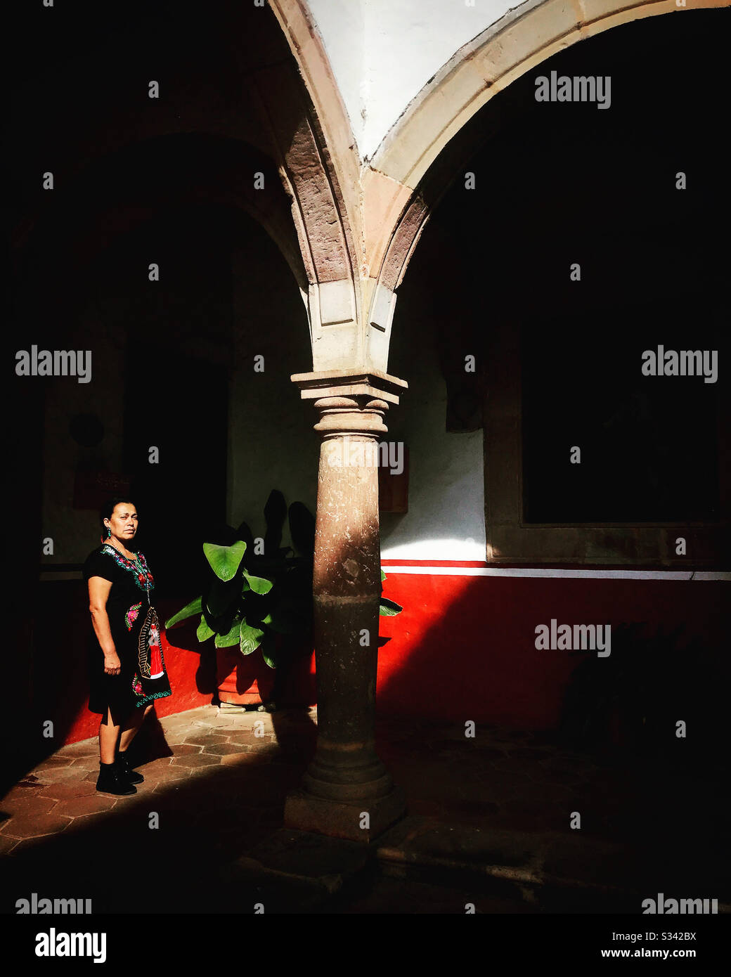 A Mexican woman visits an old Spanish home in Patzcuaro, Michoacan ...