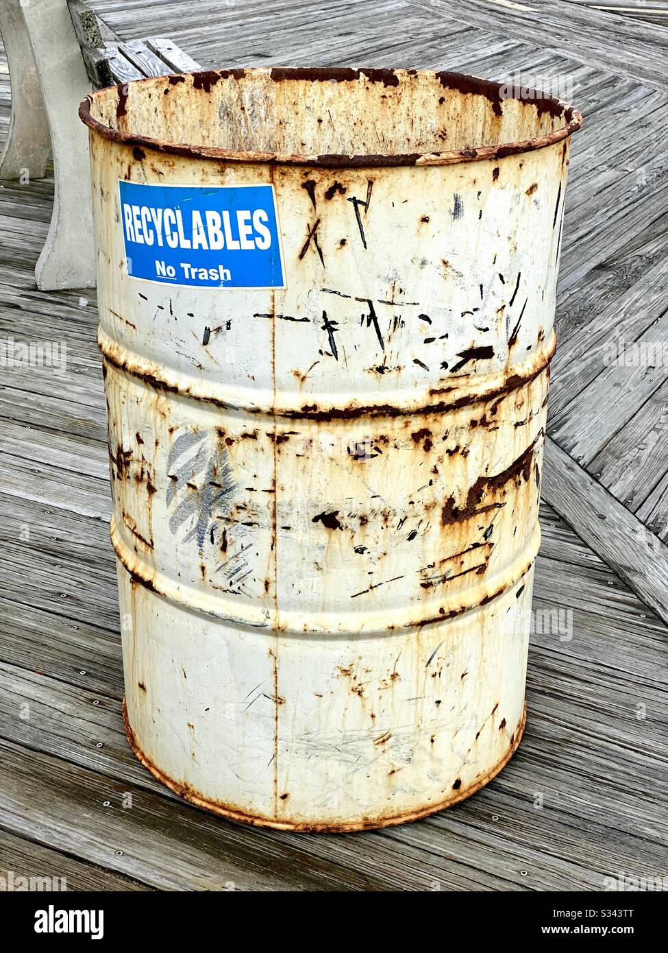 Old rusty trash can now a recyclables can on a beach, 2020 Stock Photo ...