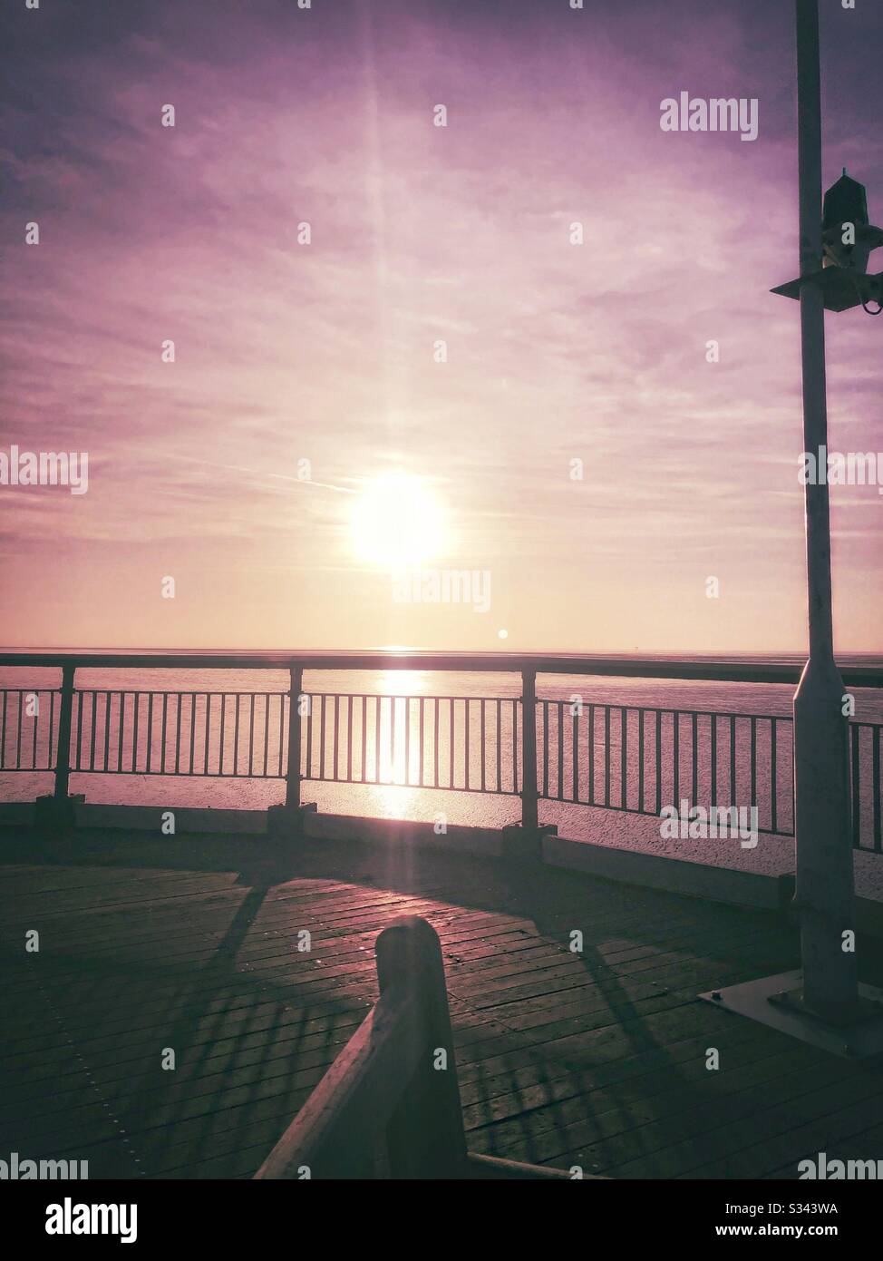 Pink sky at sunset from Southport pier overlooking the sea Stock Photo ...