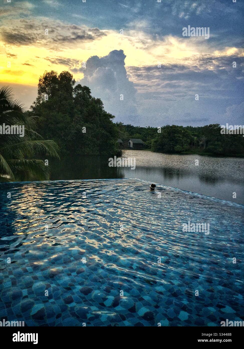 The swimming pool at sunset at Mangala Resort and Spa, Gambang, Kuantan ...