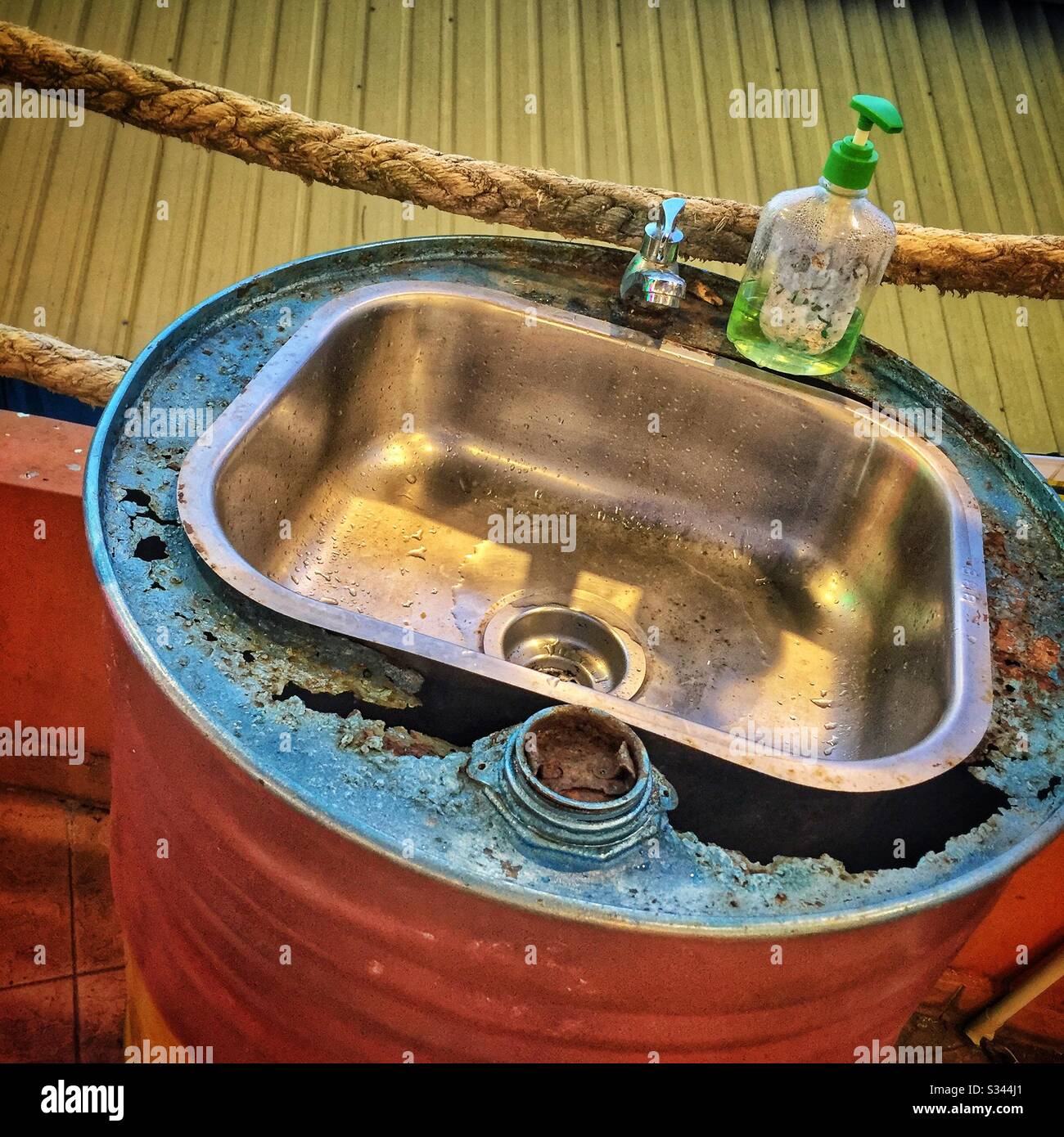 Rustic sink in a 44-gallon oil drum, D'Perahu Seafood restaurant, Kuala ...