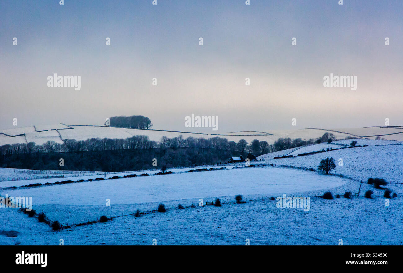 Snow covered winter landscape near Wardlow in the Peak District ...